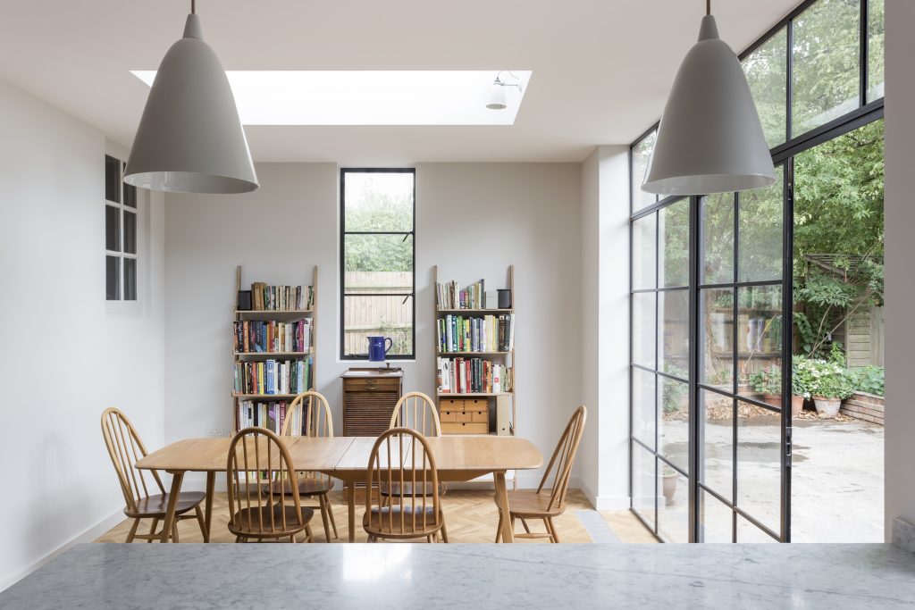 TR Studio extend Arts & Crafts family home with single-story brick and ...